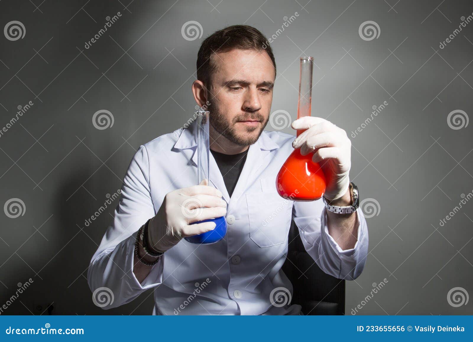 Male Doctor Biologist in a White Coat Compares Two Dangerous Biological ...