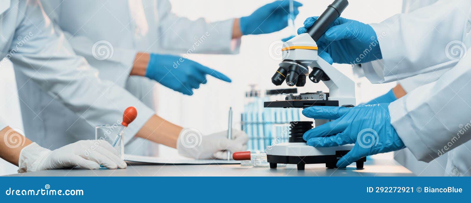 Scientist Conduct Chemical Experiment Using Microscope in Medical Lab ...