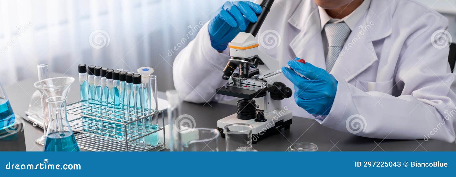 Scientist Conduct Chemical Experiment Using Microscope in Medical Lab ...