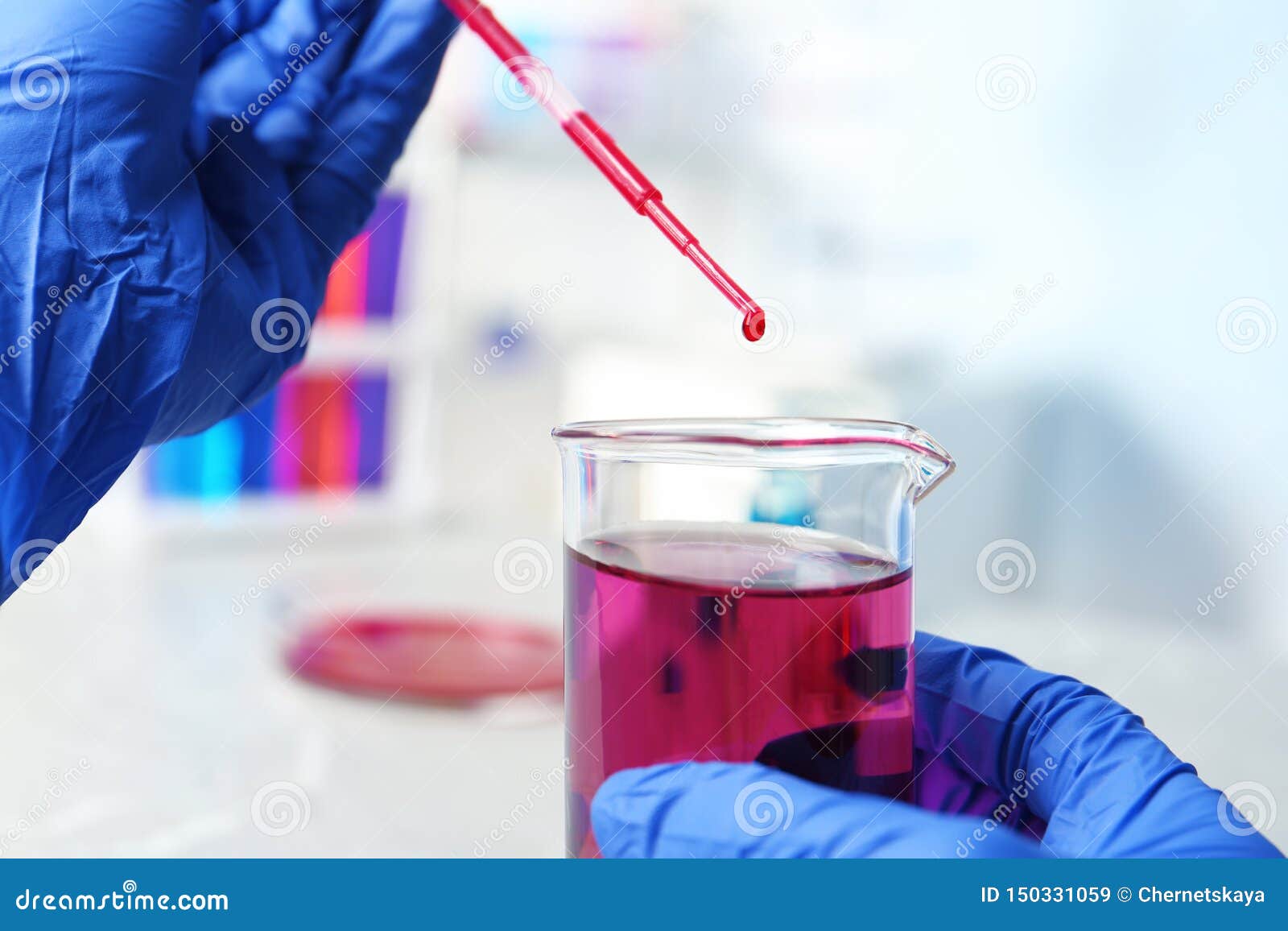 Scientist Dripping Reagent into Beaker with Sample Stock Image - Image ...