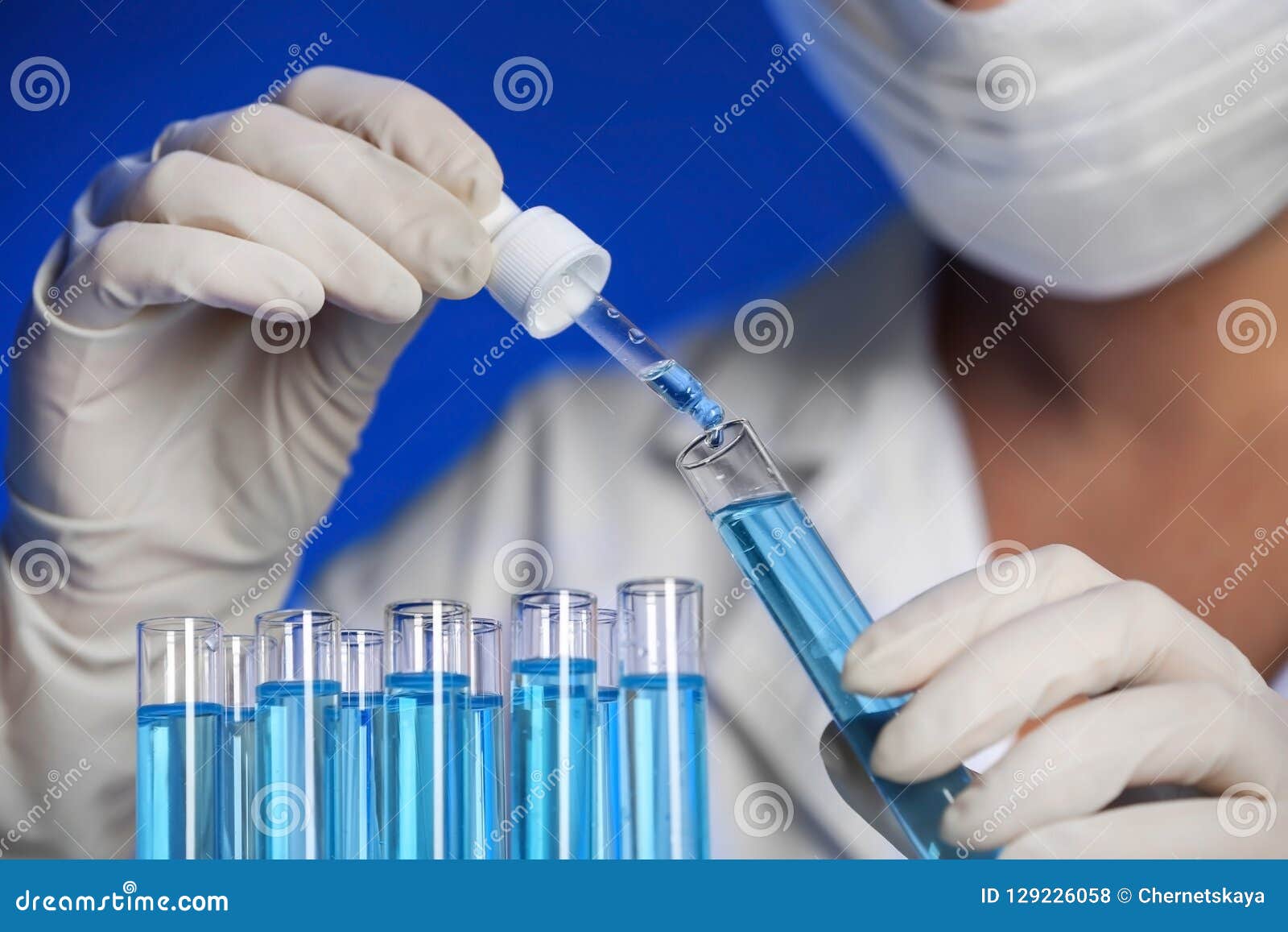 Scientist Dripping Reagent into Test Tube with Sample, Closeup Stock ...