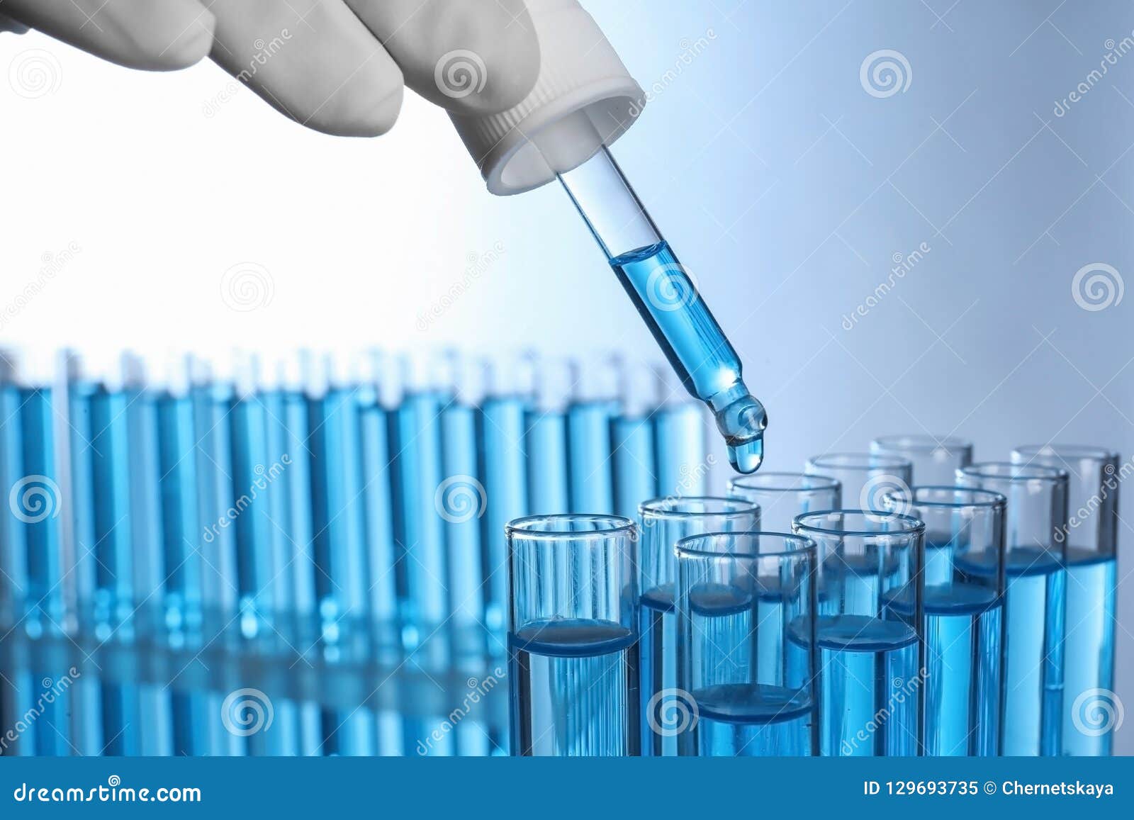 Scientist Dripping Reagent into Test Tube with Sample, Closeup. Stock ...