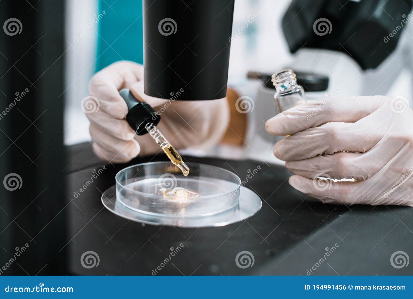 Scientist Drop of Yellow Liquid on Microscope Plate Stock Photo - Image ...