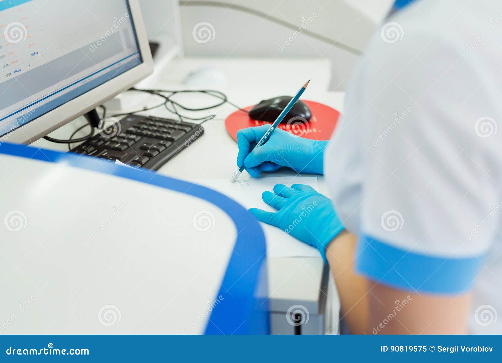 Scientist Entering Data of Blood Sample in Computer at Laboratory Stock ...