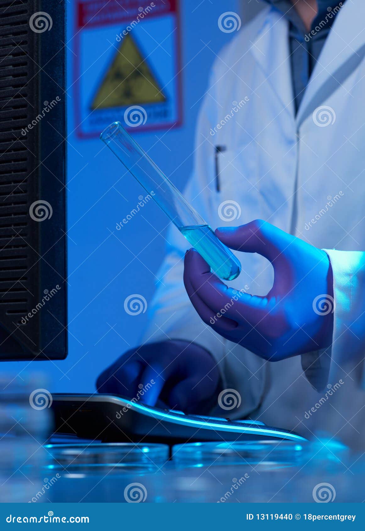 Scientist Entering Data into Computer Stock Photo - Image of blue, hand ...