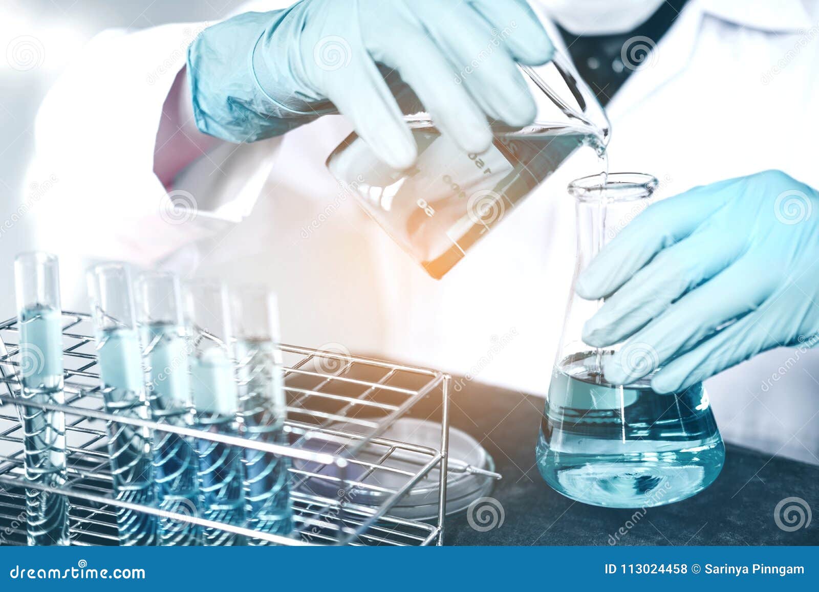 Scientist with Equipment Holding Tools during Scientific Experiment ...