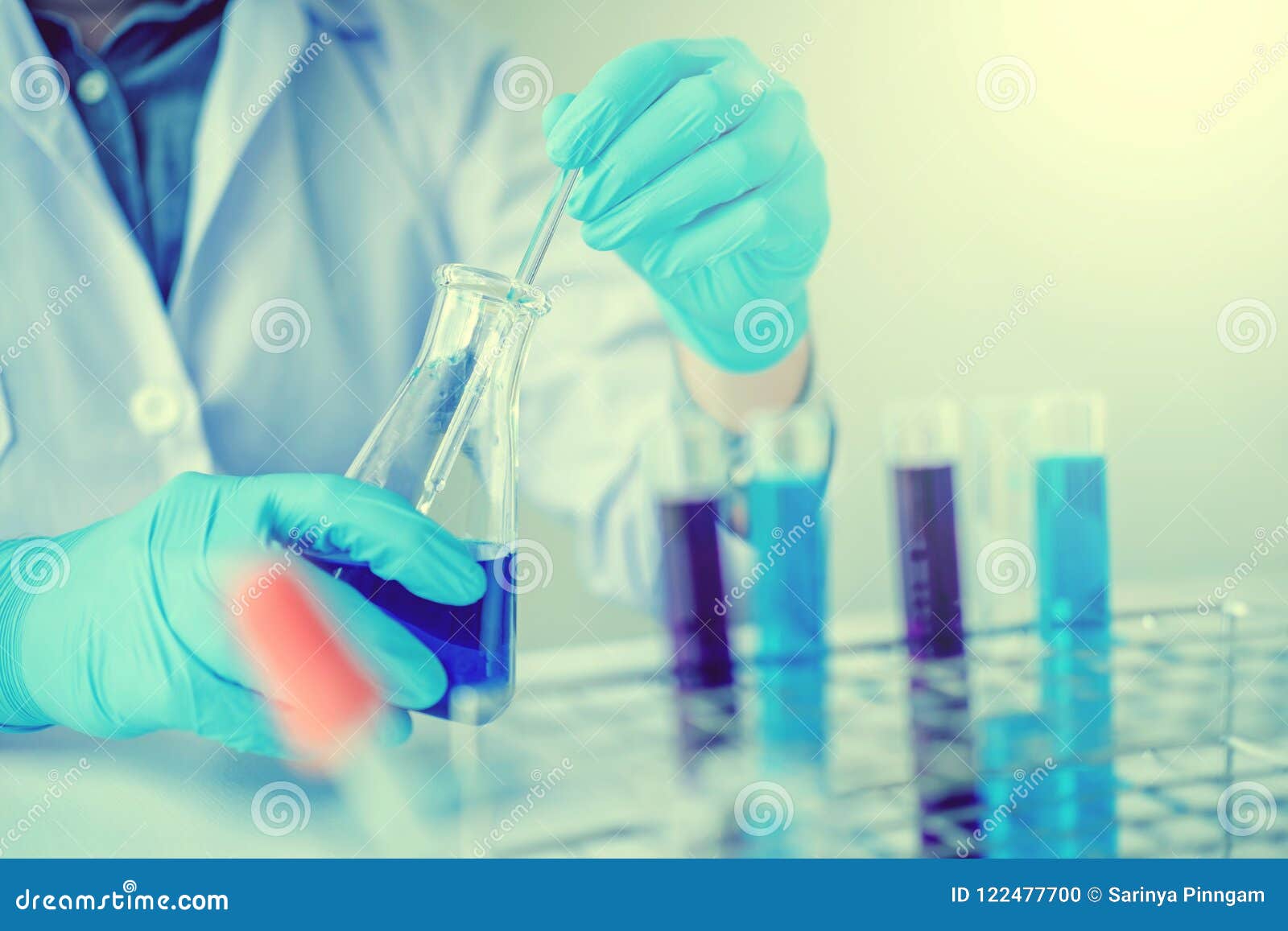 Scientist with Equipment Holding Tools during Scientific Experiment ...