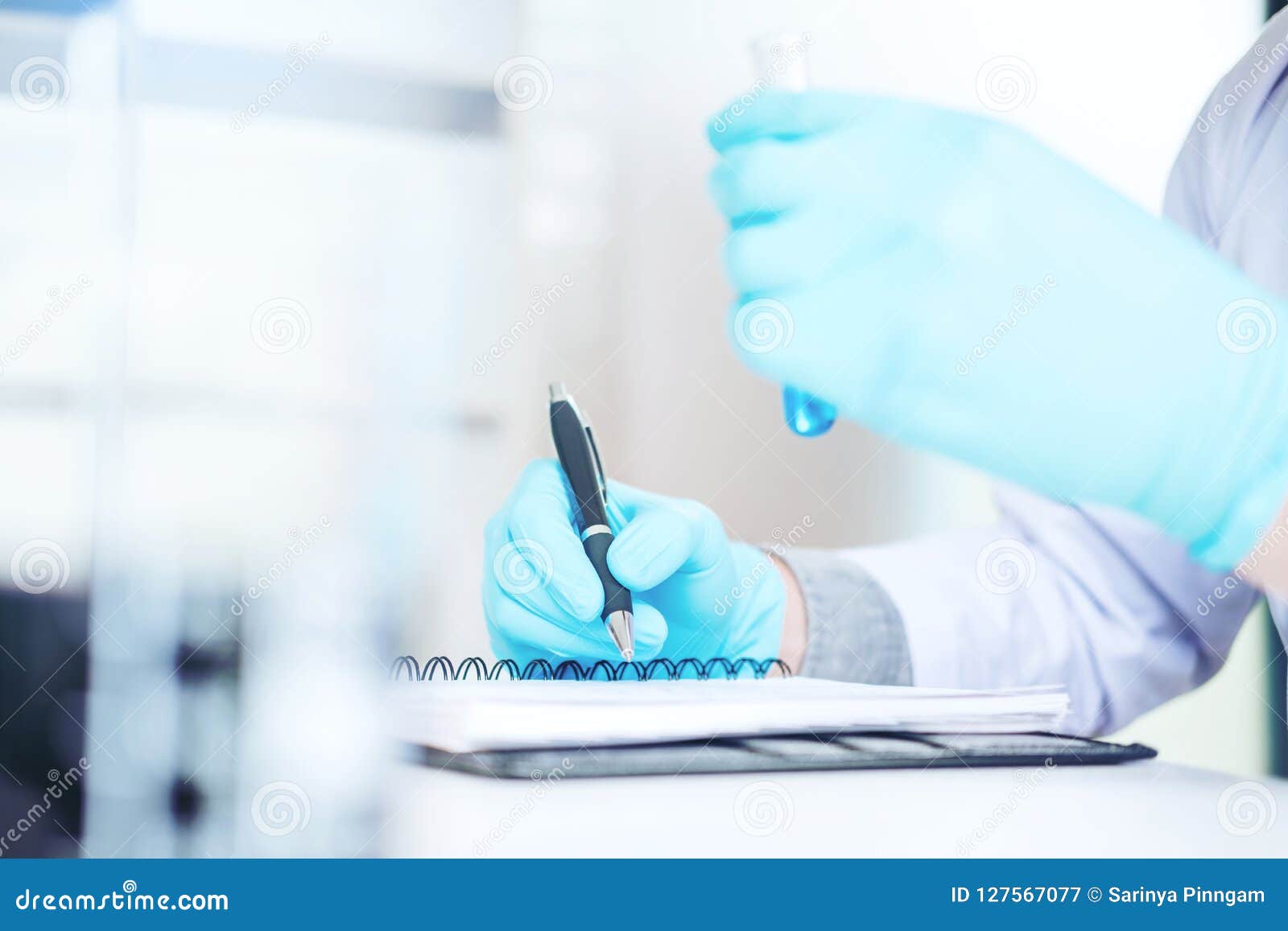 Scientist with Equipment Holding Tools during Scientific Experiment ...