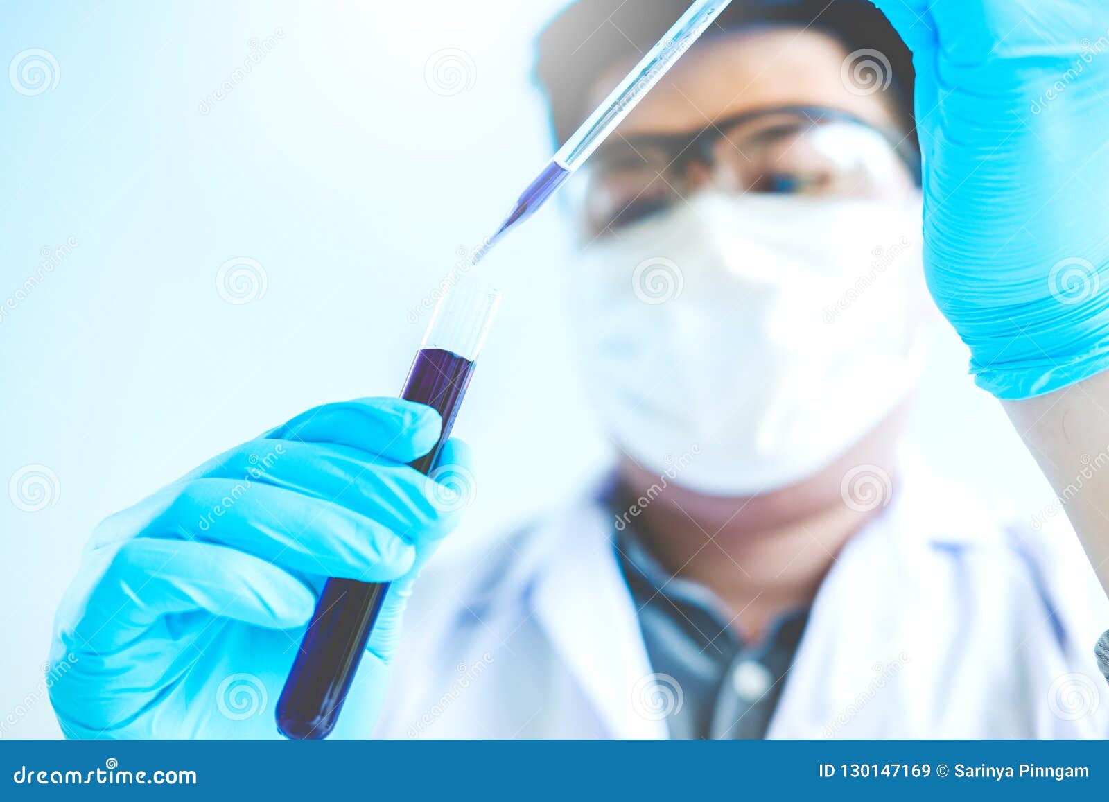 Scientist with Equipment Holding Tools during Scientific Experiment ...