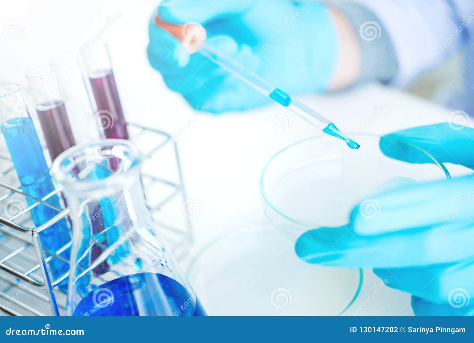 Scientist with Equipment Holding Tools during Scientific Experiment ...