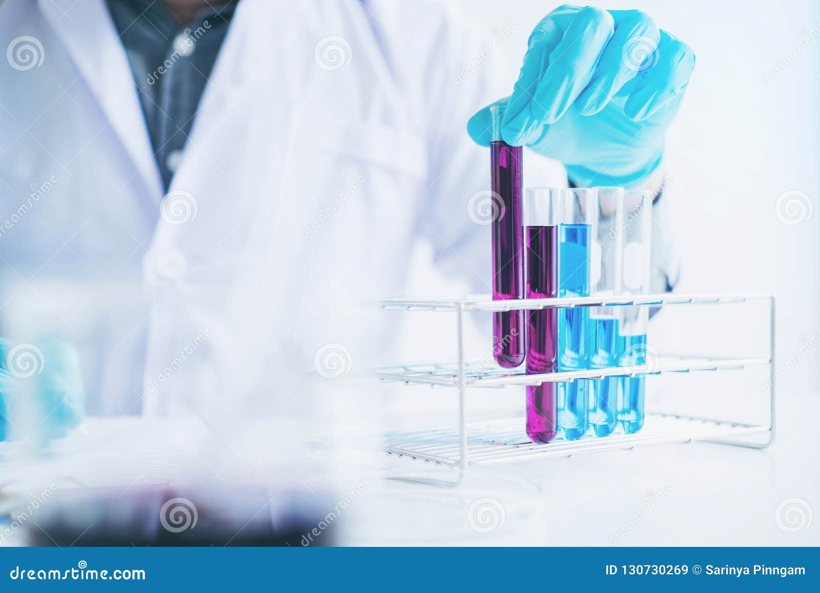 Scientist with Equipment Holding Tools during Scientific Experiment ...