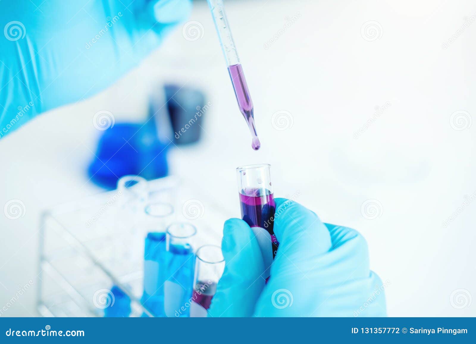 Scientist with Equipment Holding Tools during Scientific Experiment ...
