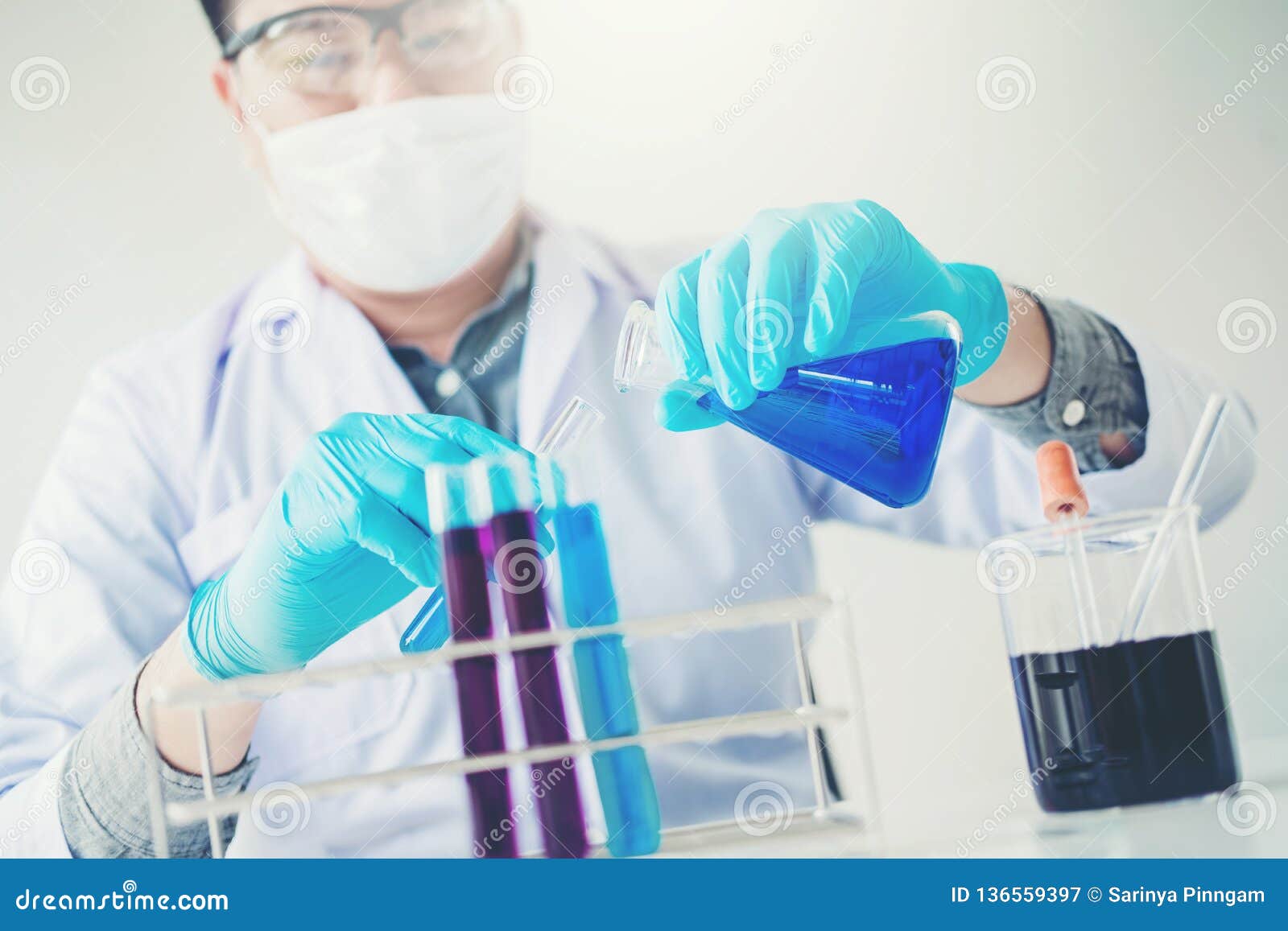 Scientist with Equipment Holding Tools during Scientific Experiment ...
