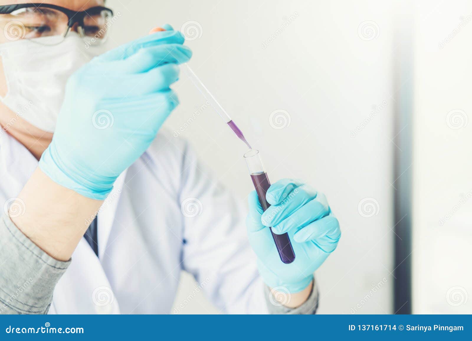 Scientist with Equipment Holding Tools during Scientific Experiment ...