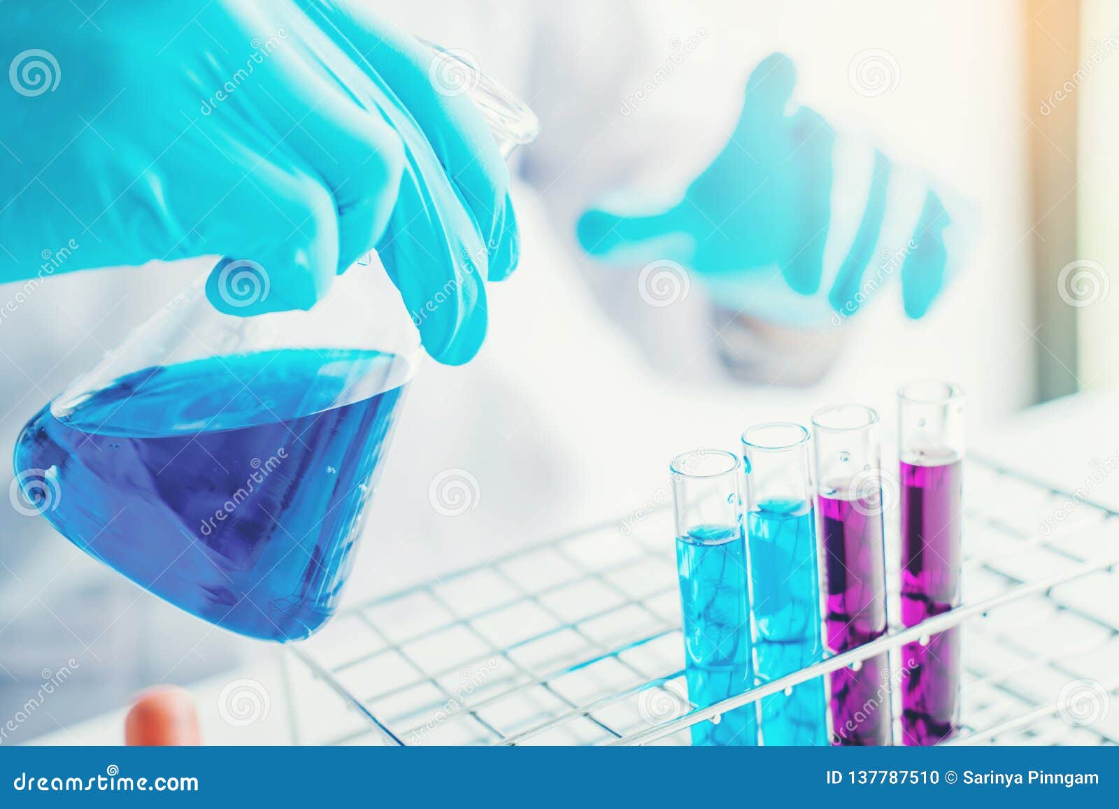 Scientist with Equipment Holding Tools during Scientific Experiment ...