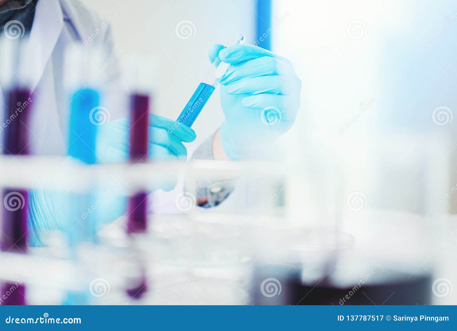 Scientist with Equipment Holding Tools during Scientific Experiment ...