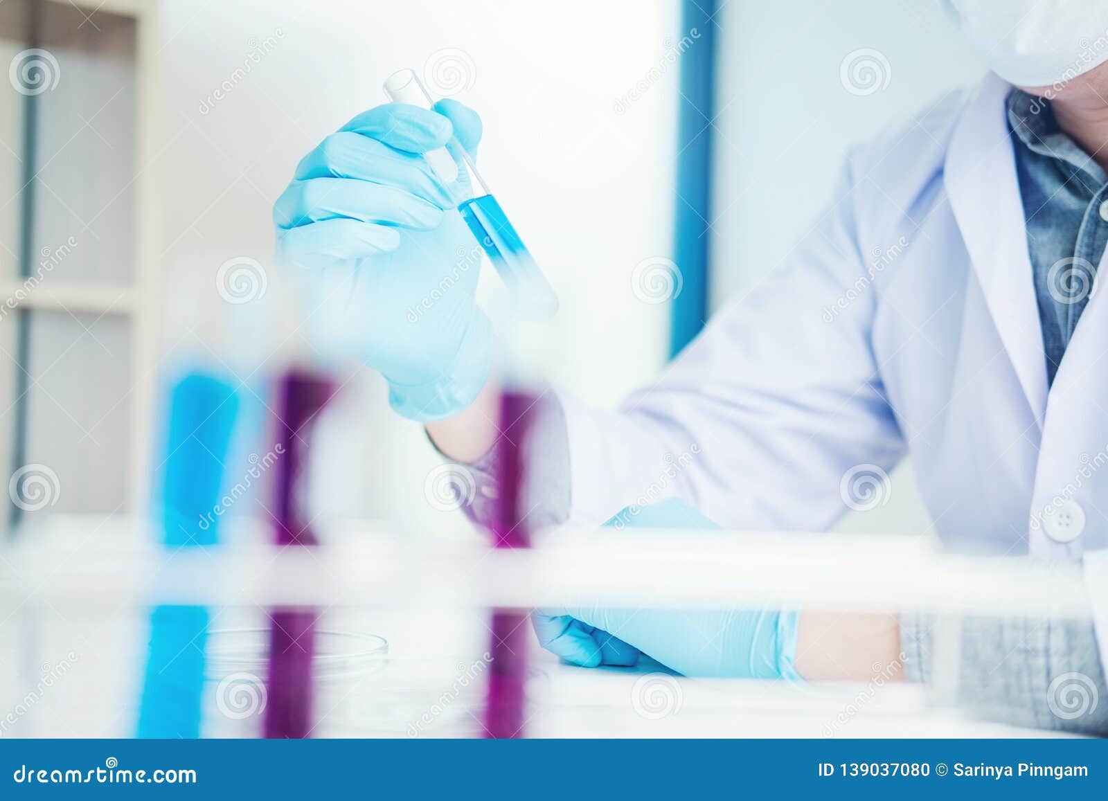 Scientist with Equipment Holding Tools during Scientific Experiment ...