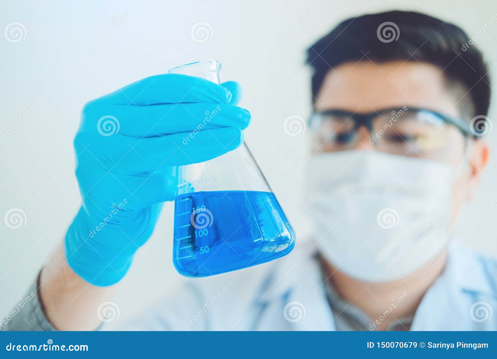 Scientist with Equipment Holding Tools during Scientific Experiment ...