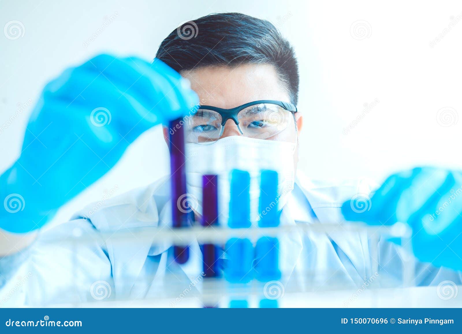 Scientist with Equipment Holding Tools during Scientific Experiment ...