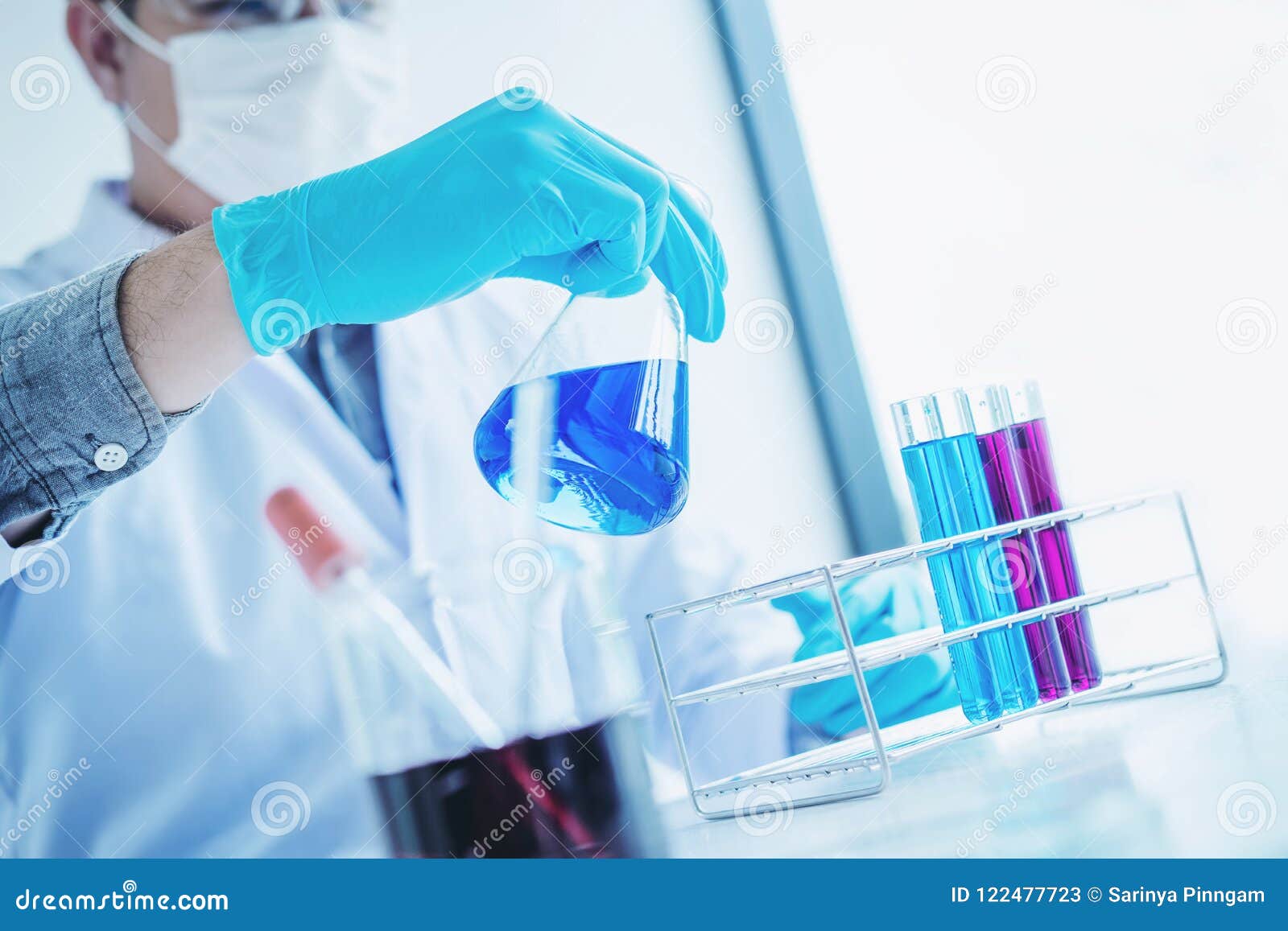Scientist with Equipment Holding Tools during Scientific Experiment ...