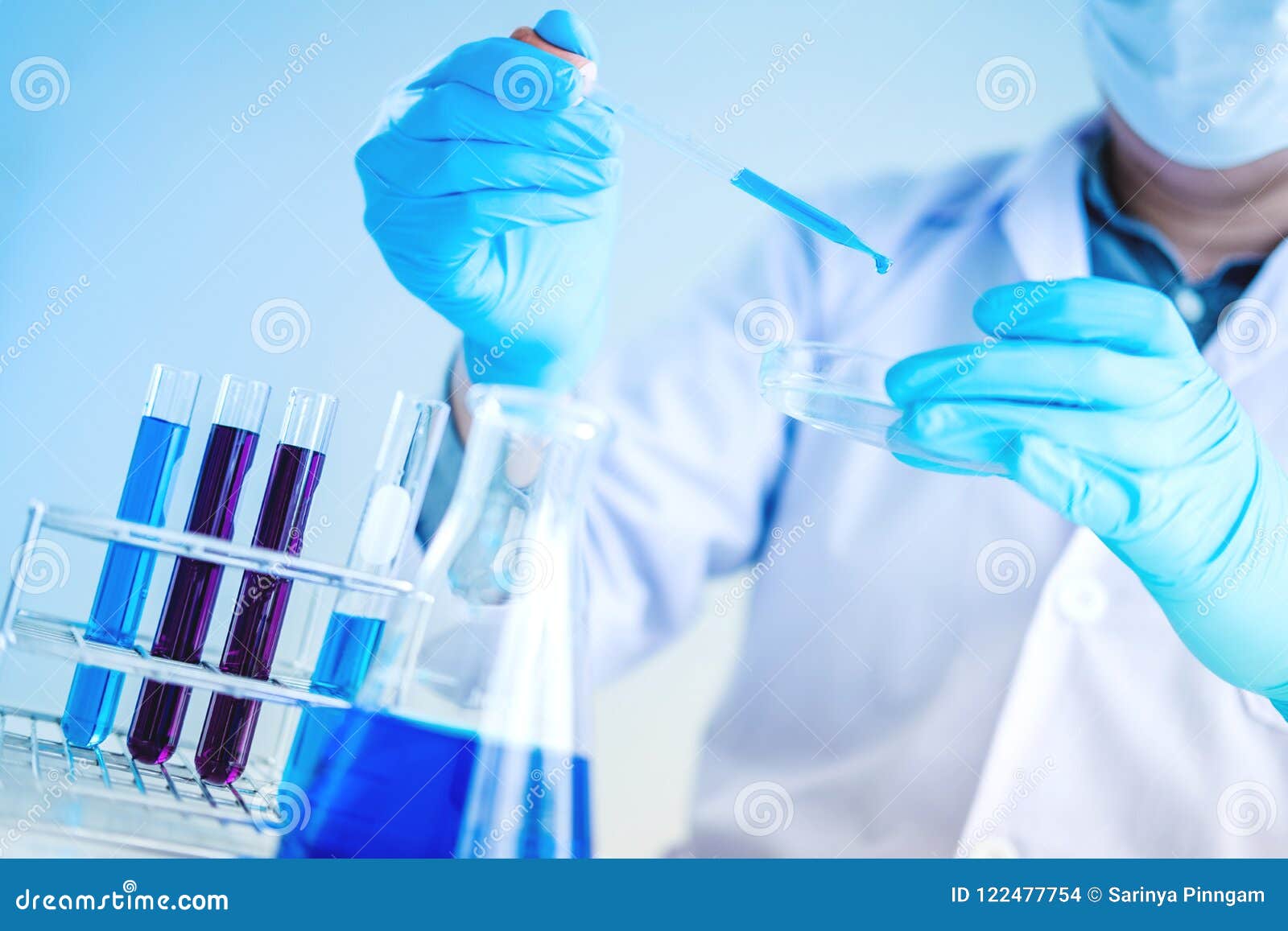 Scientist with Equipment Holding Tools during Scientific Experiment ...