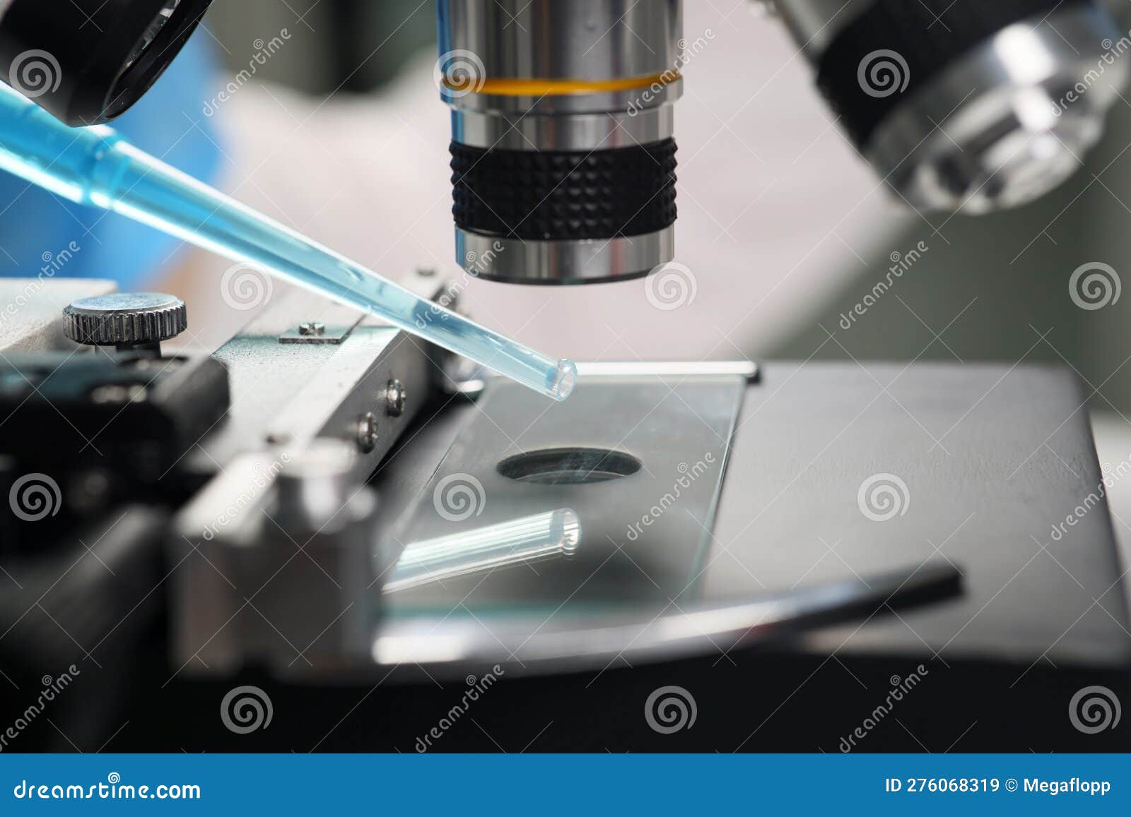 Scientist Examines Blue Reagent Under Electronic Microscope Stock Image ...