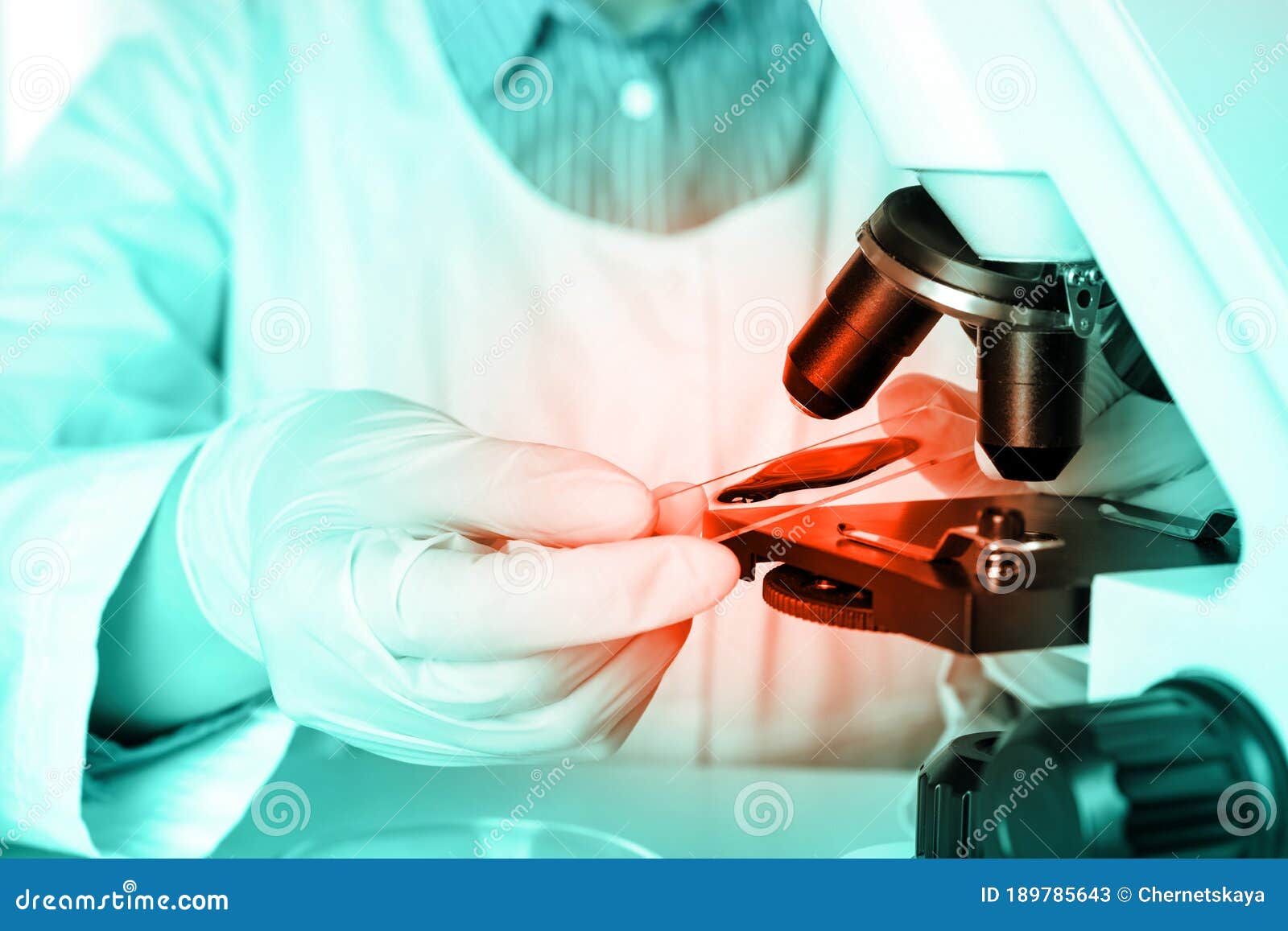 Scientist Examining Blood Sample with Microscope. Laboratory Analysis ...