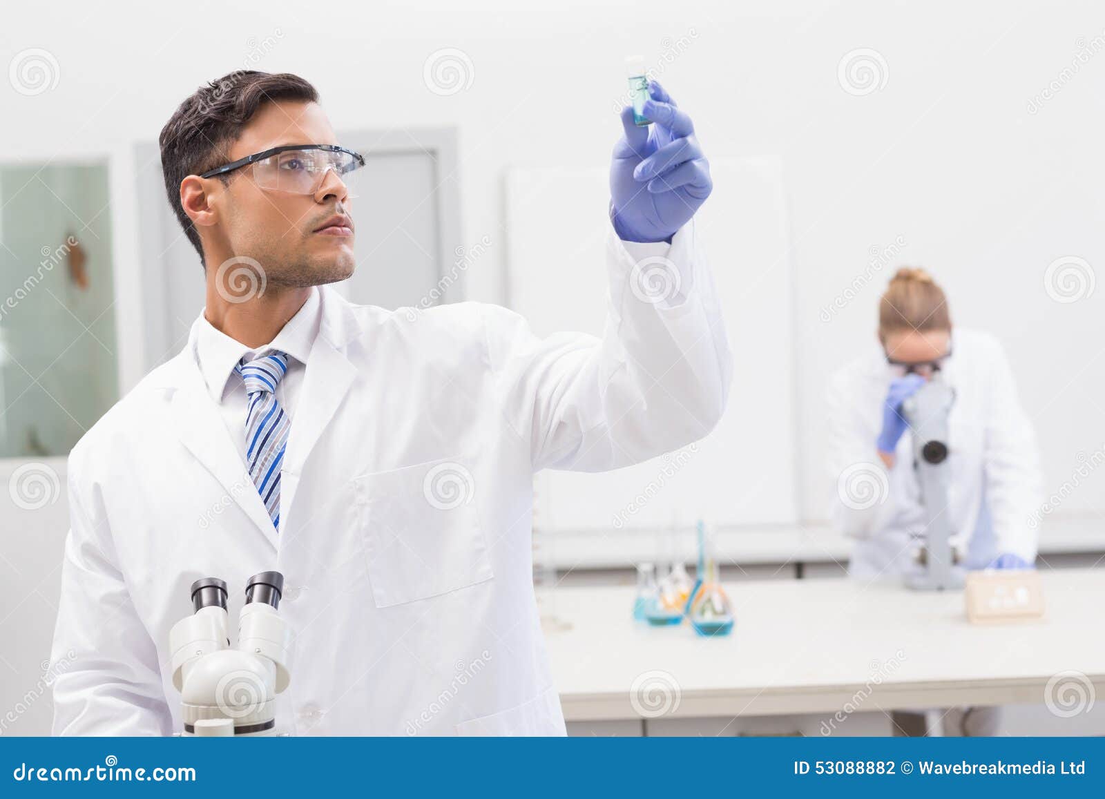 Scientist Examining Blue Precipitate in Tube Stock Photo - Image of ...