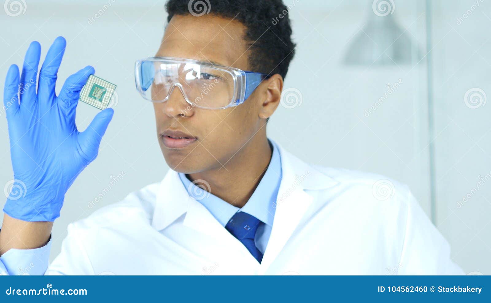 Scientist Examining, Looking on New Electronic Chip of Computer Stock ...