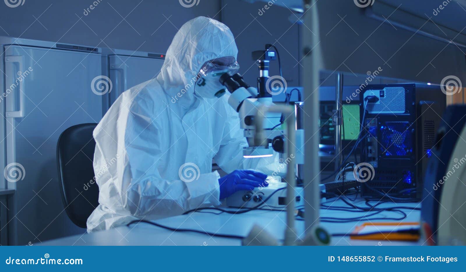 Scientist Examining Sample with a Microscope Stock Photo - Image of ...