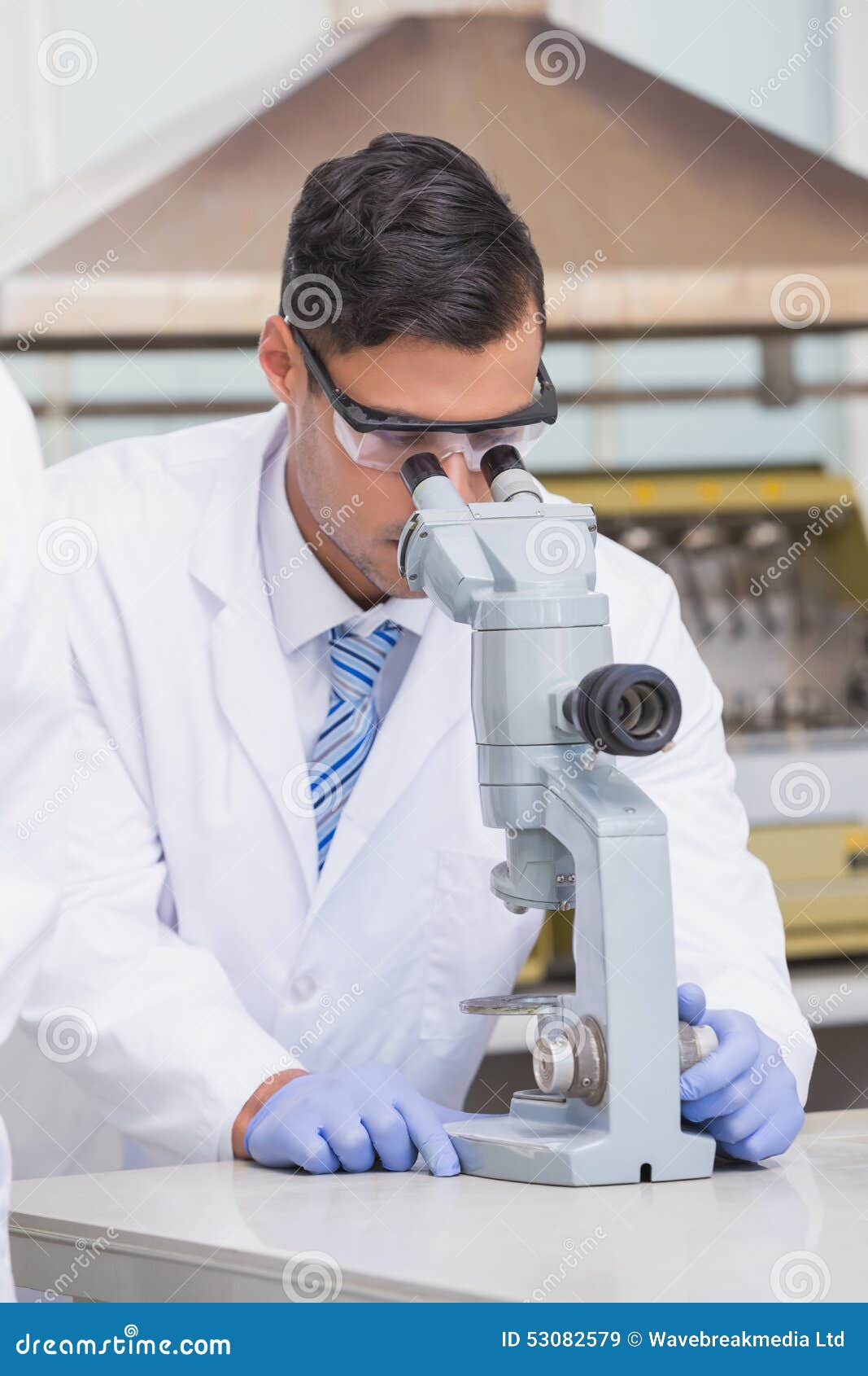 Scientist Examining Something with the Microscope Stock Image - Image ...