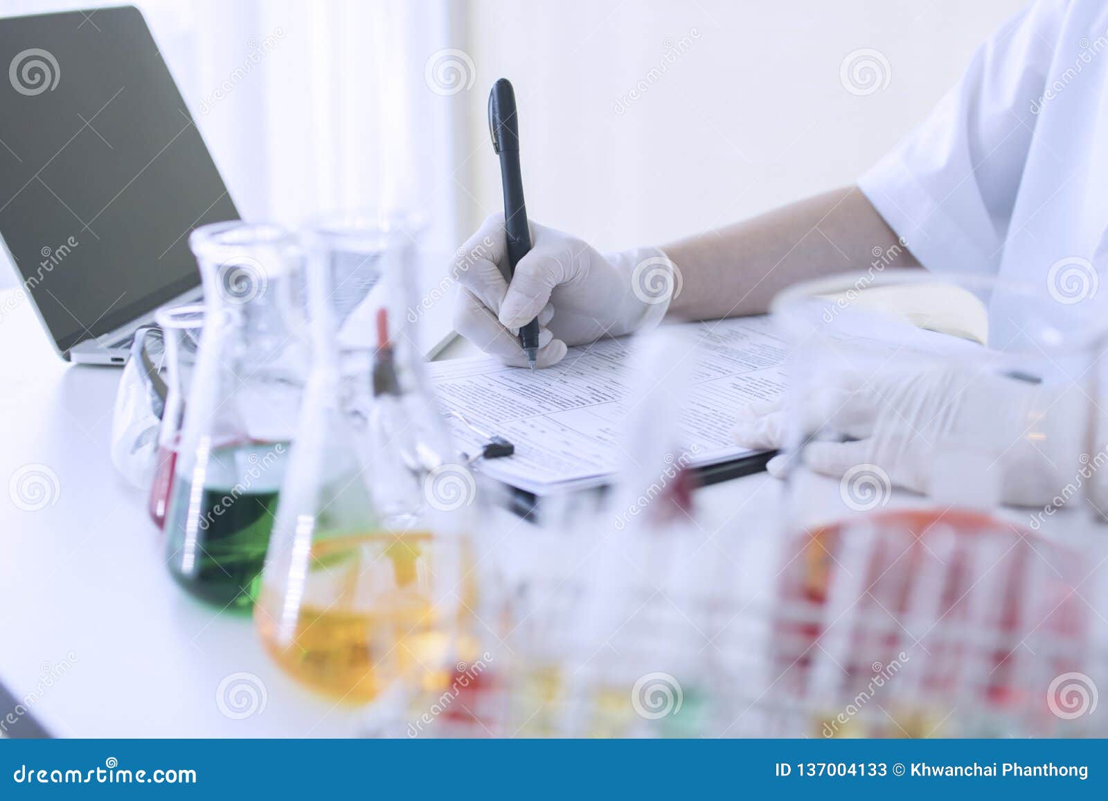 Scientist Experiment Chemical Liquid and Writing Information on Paper ...