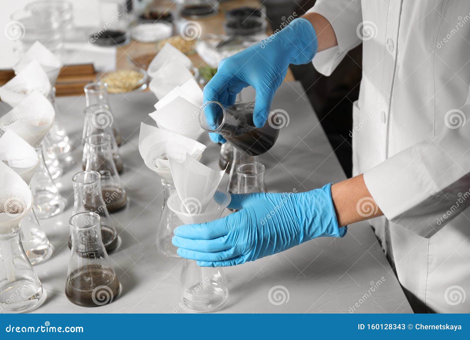 Scientist Filtering Soil Samples At Table. Laboratory Analysis Stock ...