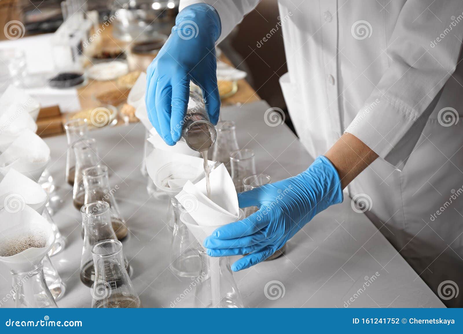 Scientist Filtering Soil Samples at Table. Laboratory Analysis Stock ...