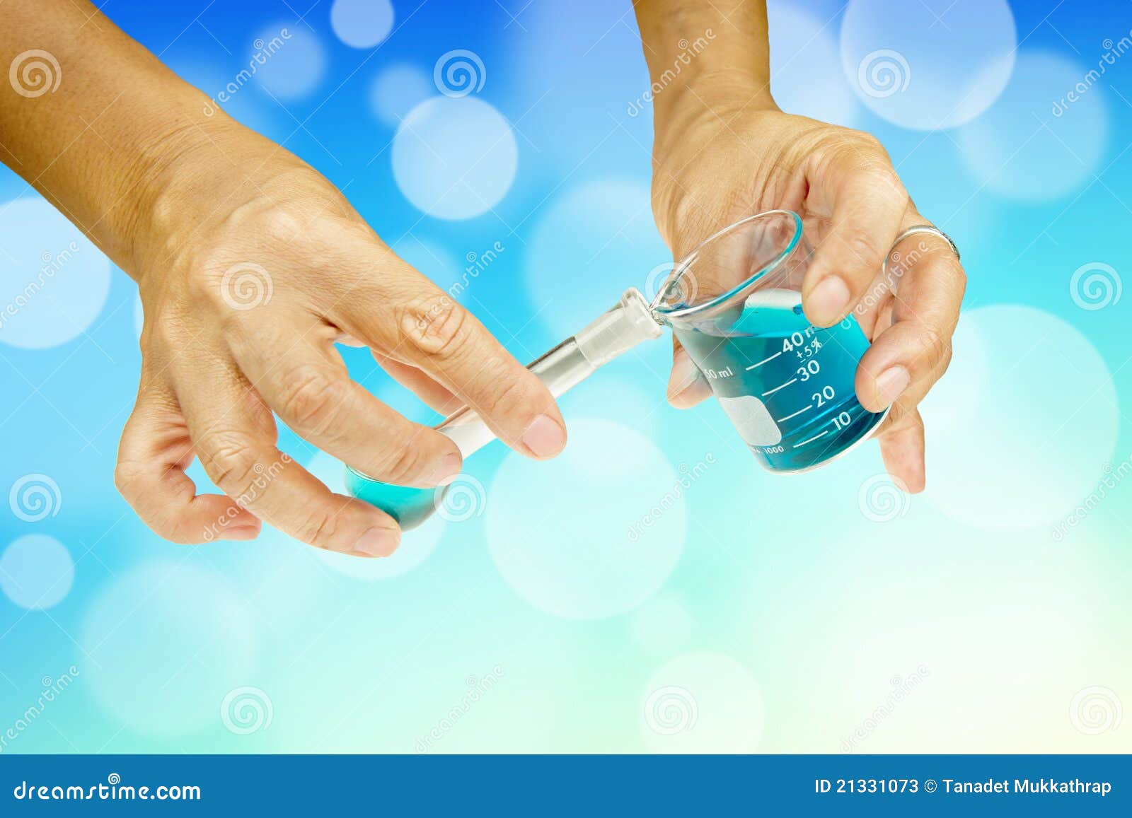 Scientist Hand Pouring Blue Liquid Stock Image - Image of experiment ...