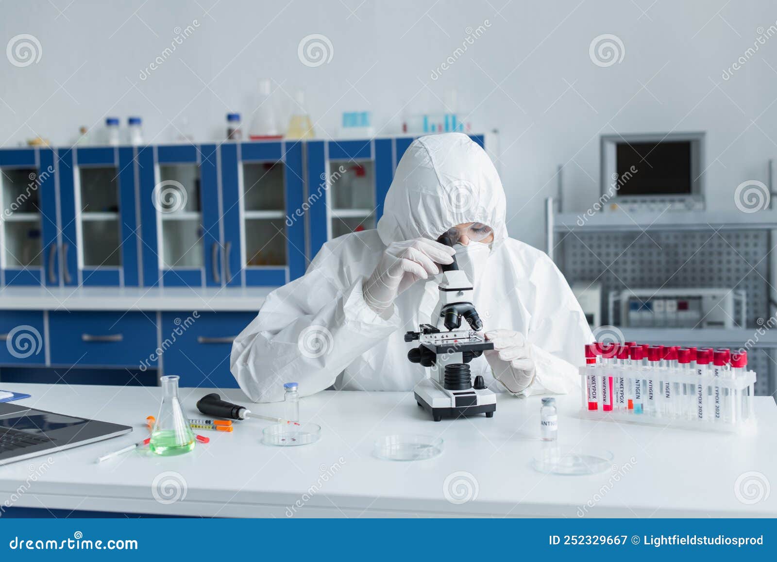 Scientist in Hazmat Suit Using Microscope Stock Image - Image of ...