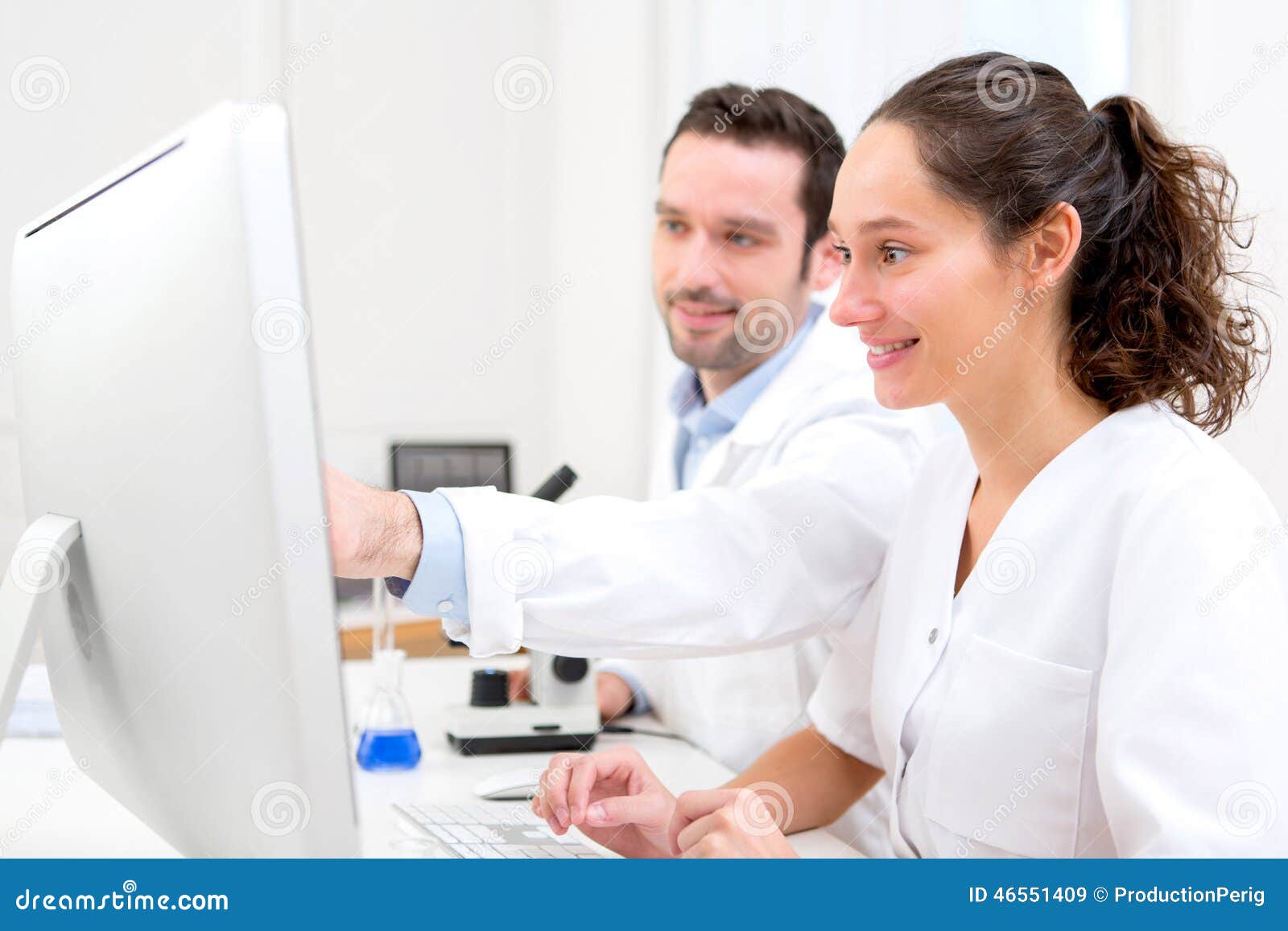 Scientist and Her Assistant in a Laboratory Stock Image - Image of ...