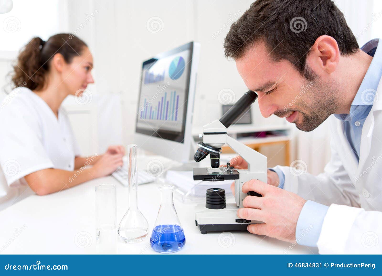 Scientist and Her Assistant in a Laboratory Stock Image - Image of ...
