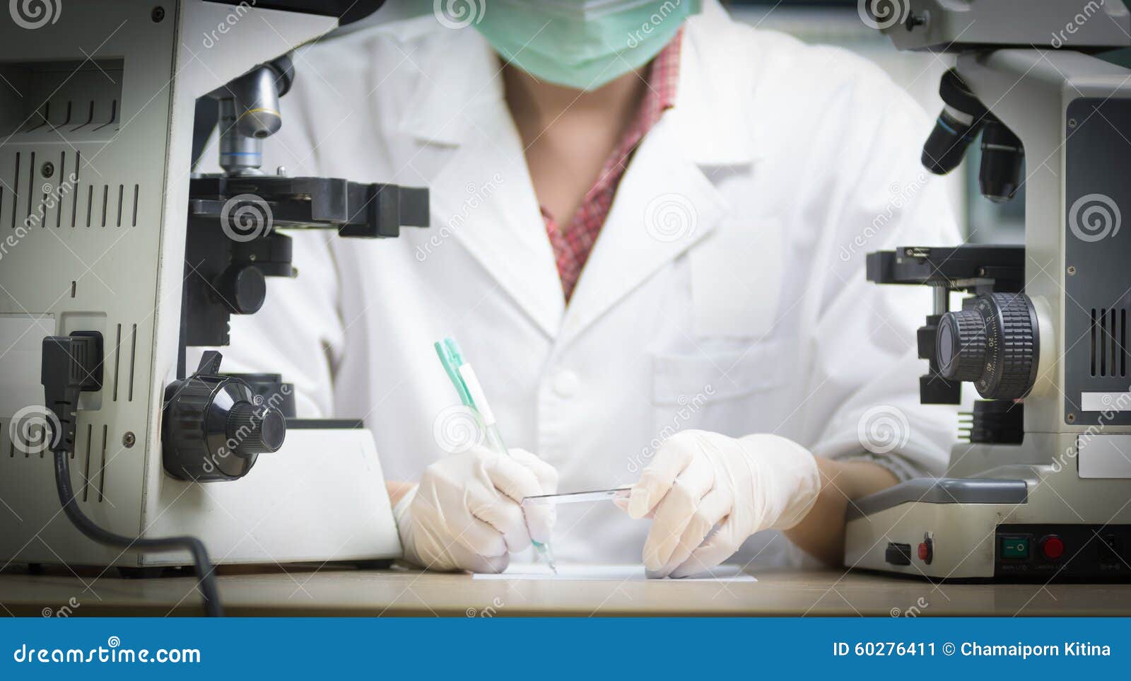 Scientist Hold Slide in Left Hand and Write Something Down Stock Image ...