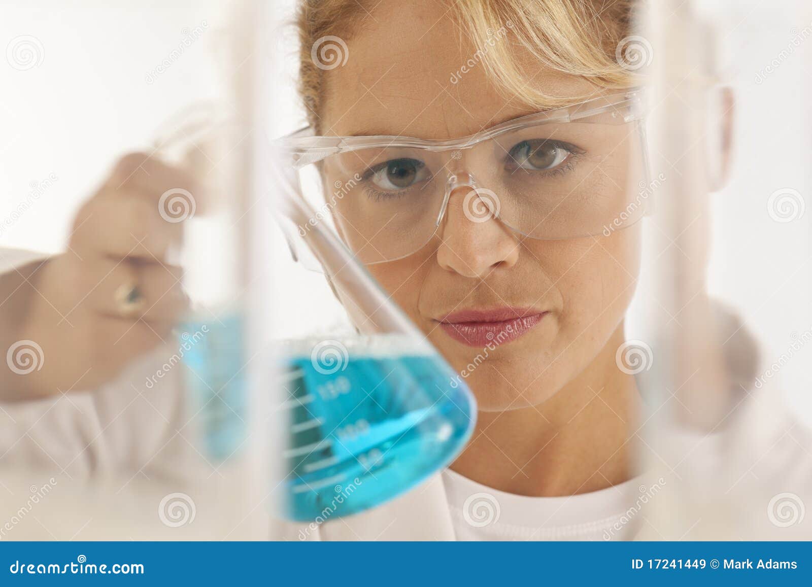 Scientist holding beaker stock image. Image of chemistry - 17241449