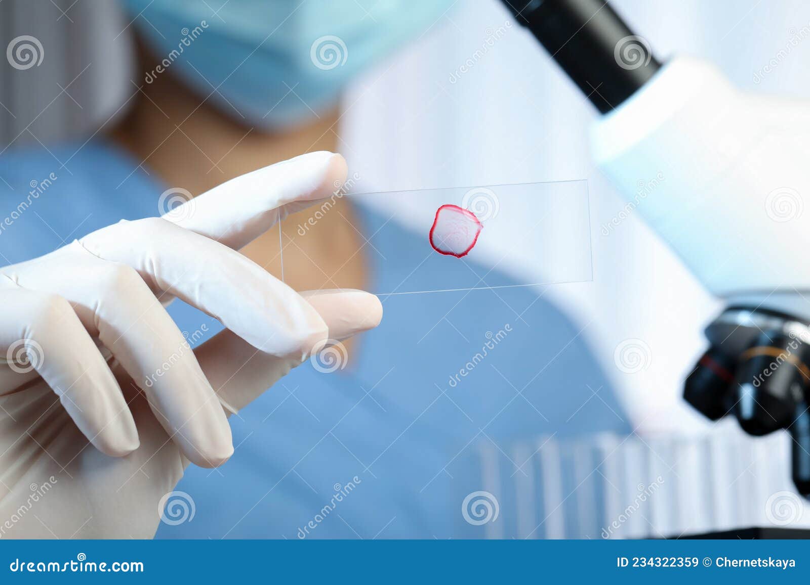 Scientist Holding Microscope Slide with Red Sample in Laboratory ...