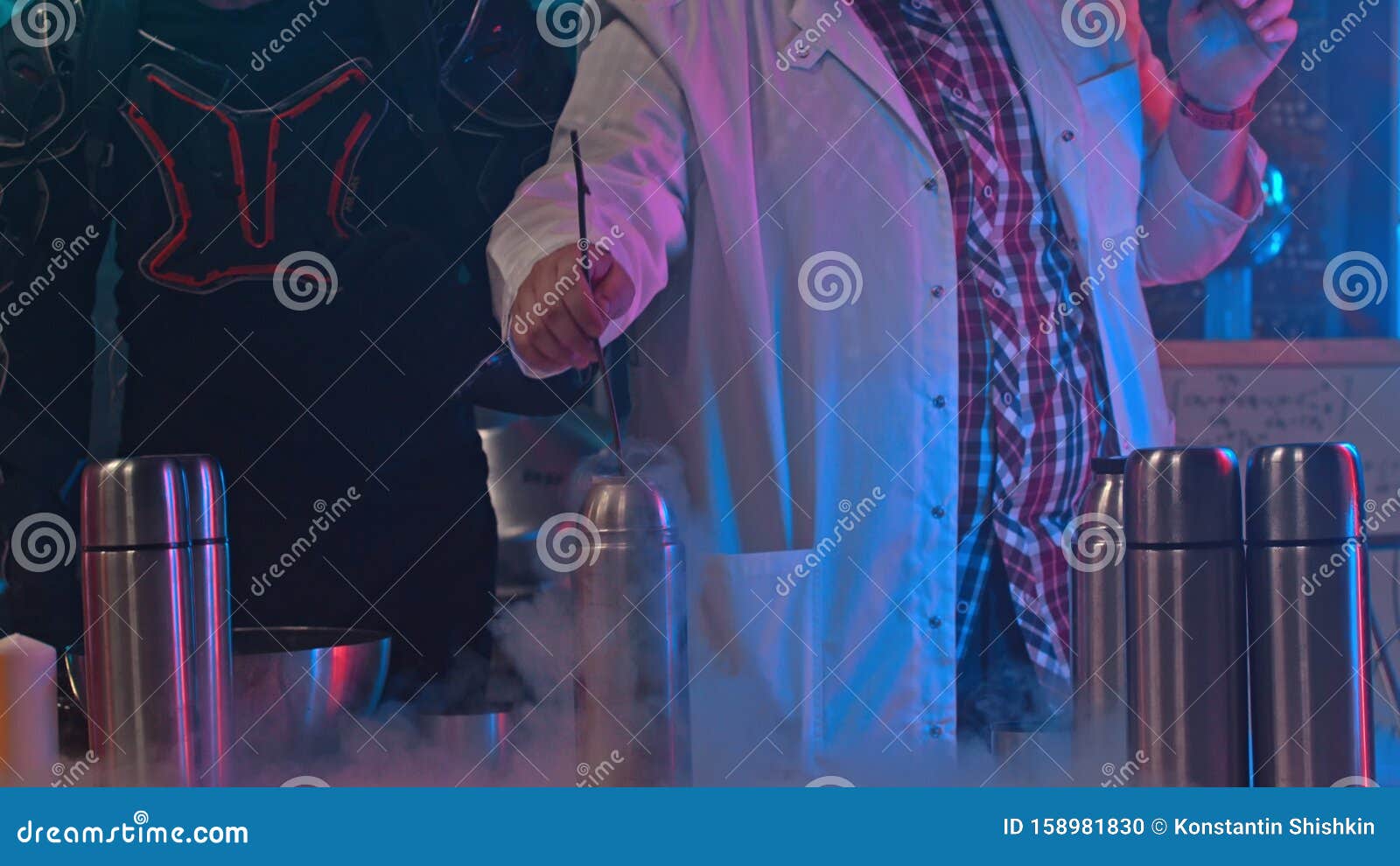 A Scientist Holding a Rose in the Thermos with Liquid Nitrogen Stock ...