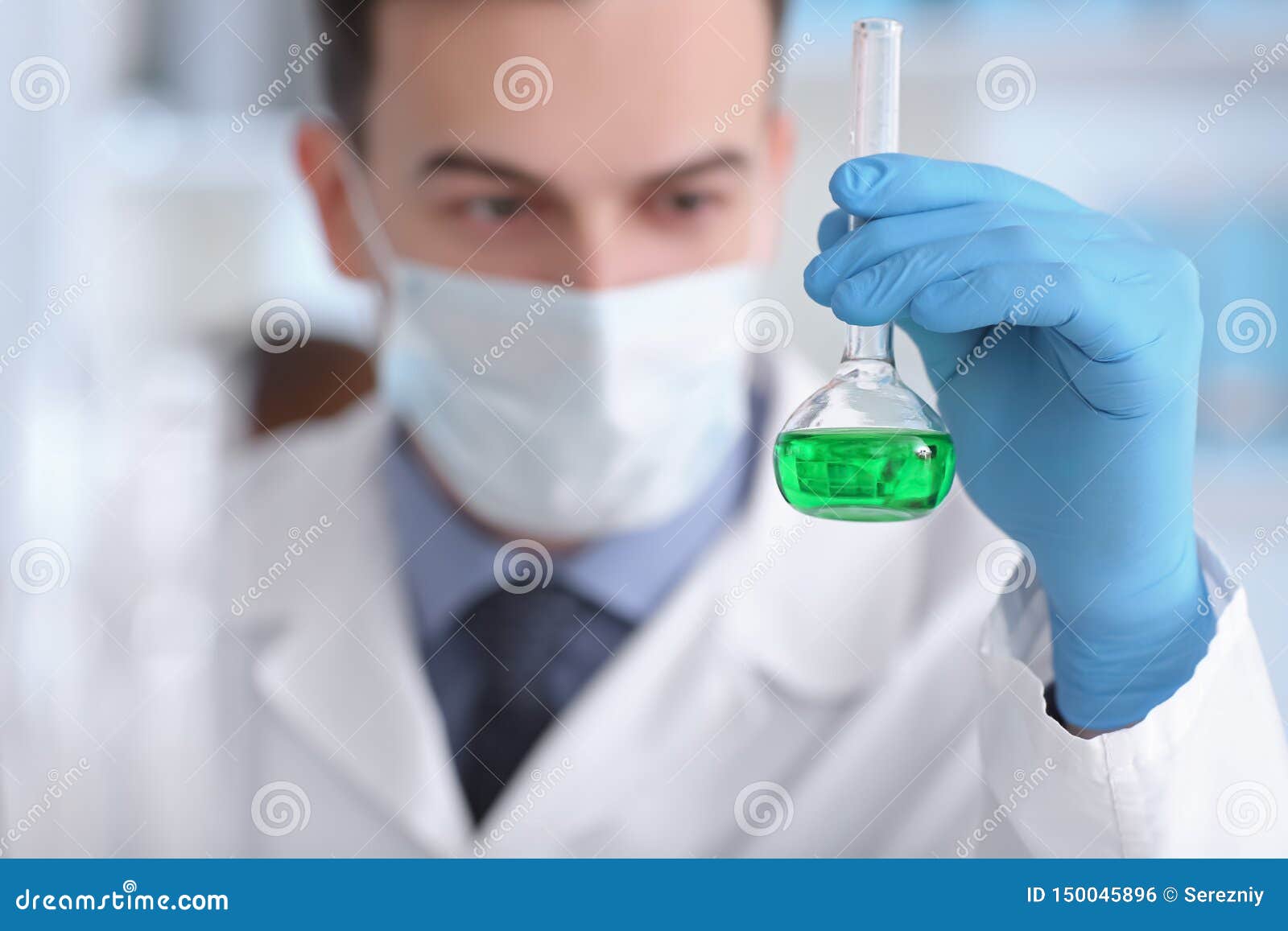 Scientist Holding Test Flask with Sample in Laboratory Stock Photo ...