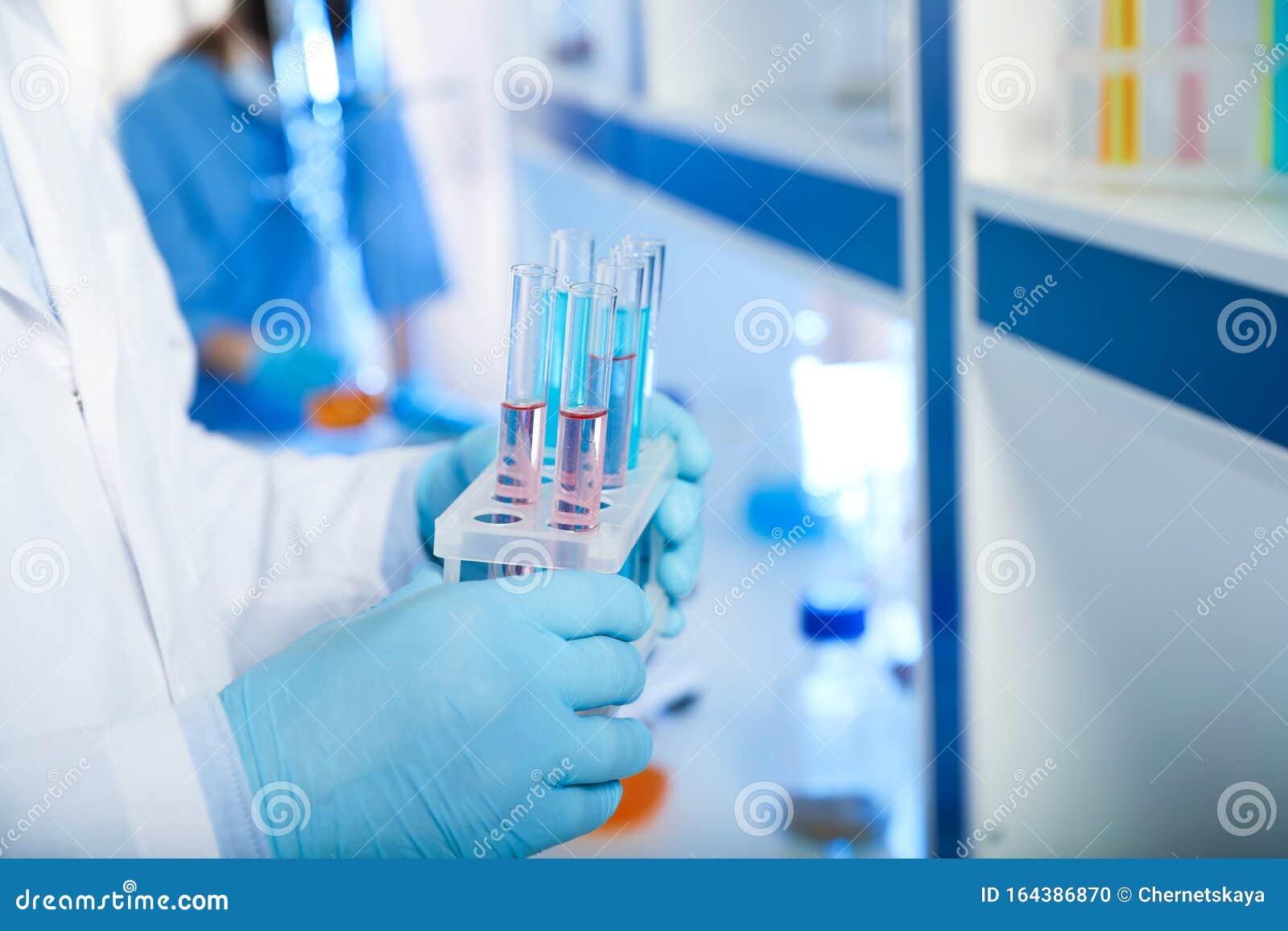 Scientist Holding Test Tubes with Liquid Indoors. Laboratory Analysis ...