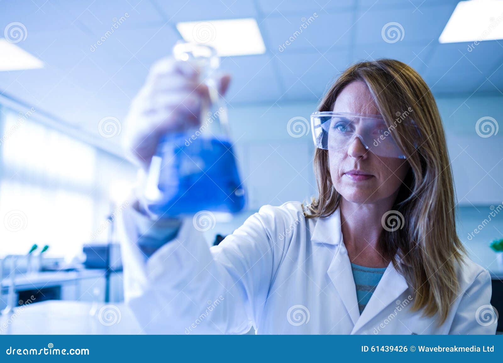 Scientist Holding Up Beaker of Chemical Stock Photo - Image of ...