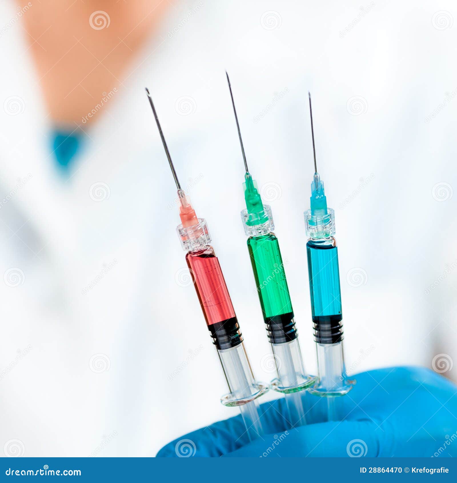 Scientist Holds Three Injection Filled with Green, Red, and Blue Stock ...