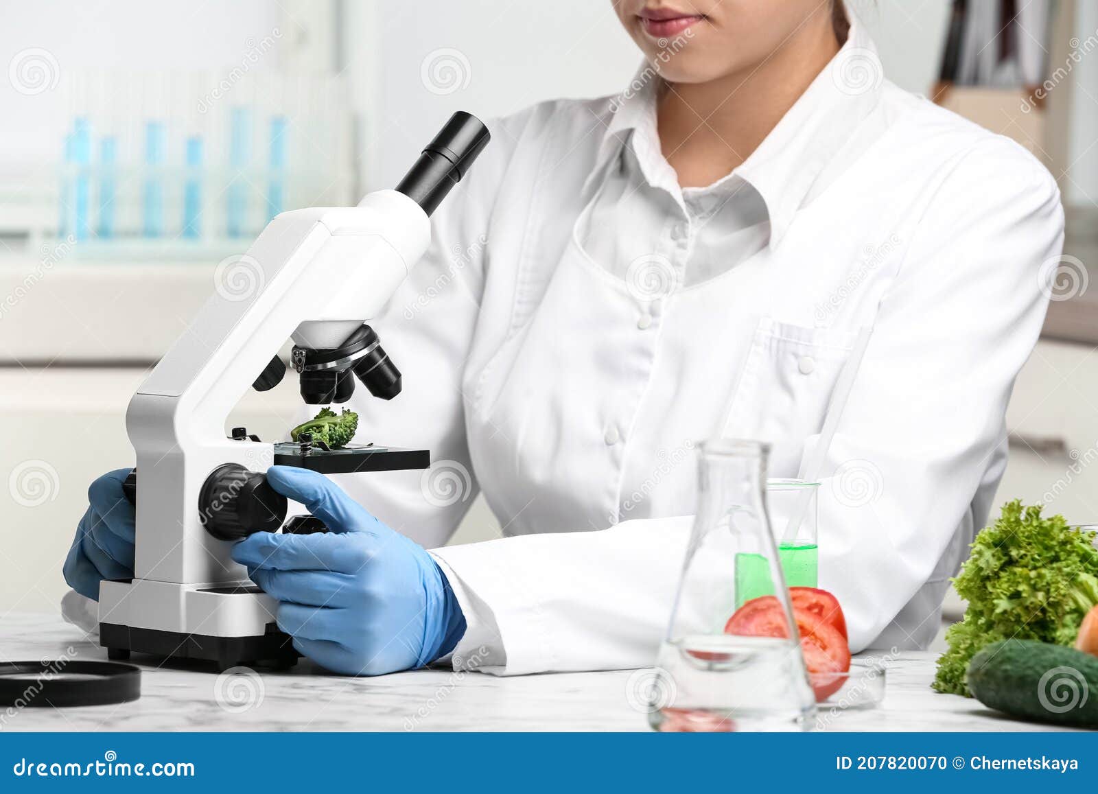 Scientist Inspecting Broccoli with Microscope in Laboratory, Closeup ...