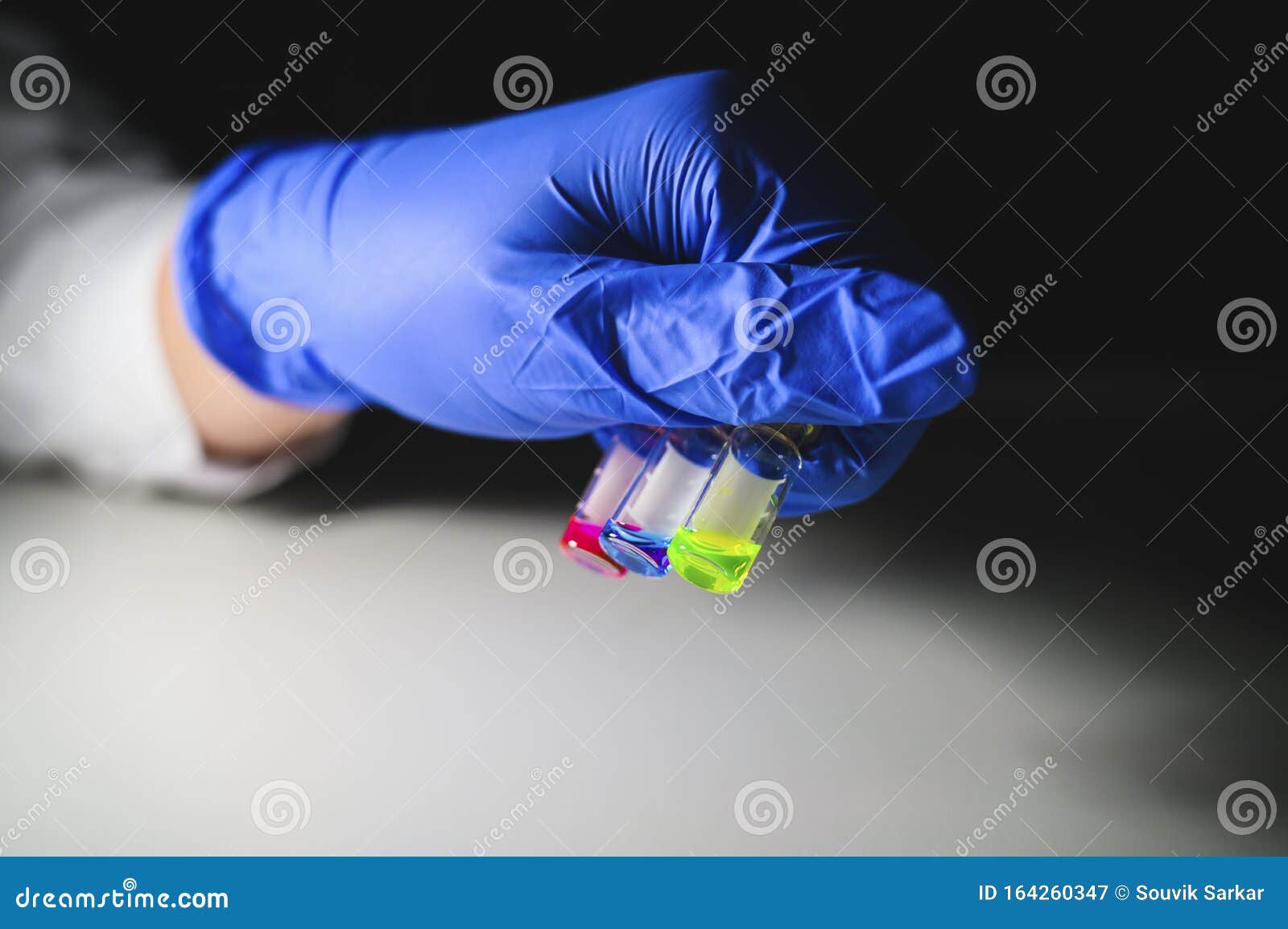 Scientist Investigating Three Colourful Solution in Different LCMS ...