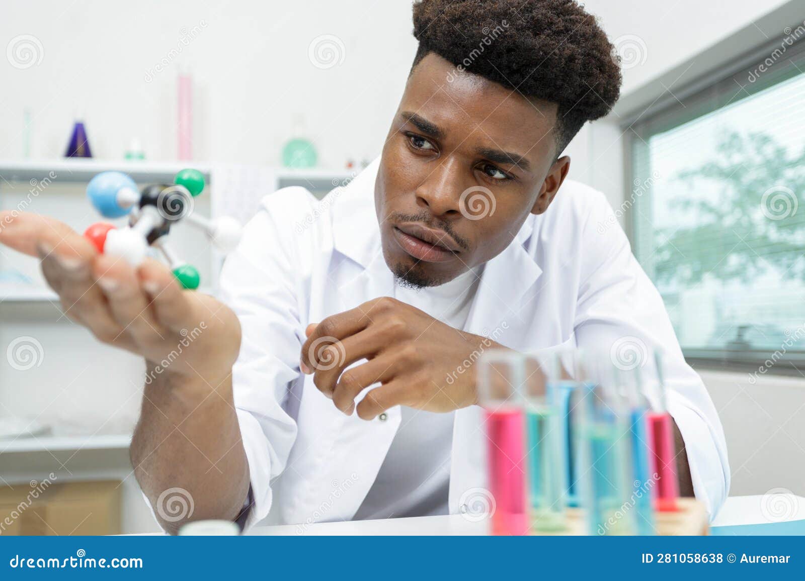 Scientist in Lab Coat Holding Molecular Models Stock Photo - Image of ...