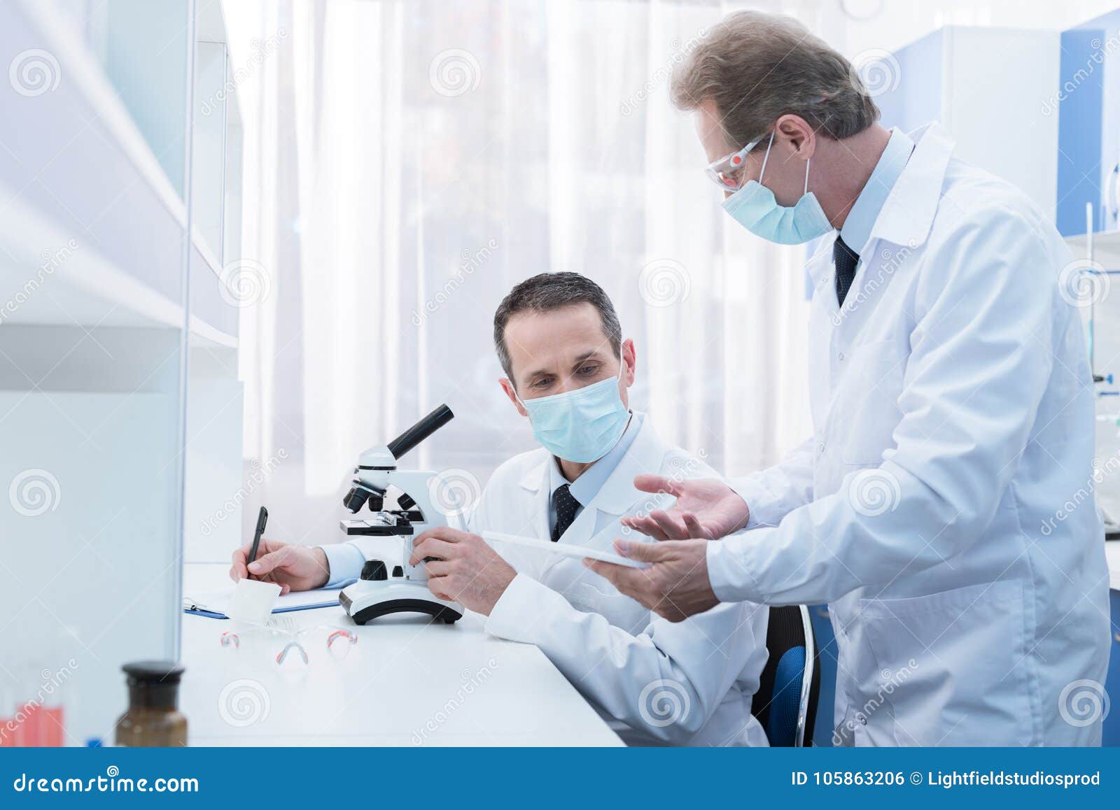 Scientists Talking while Working in Lab Stock Photo - Image of team ...